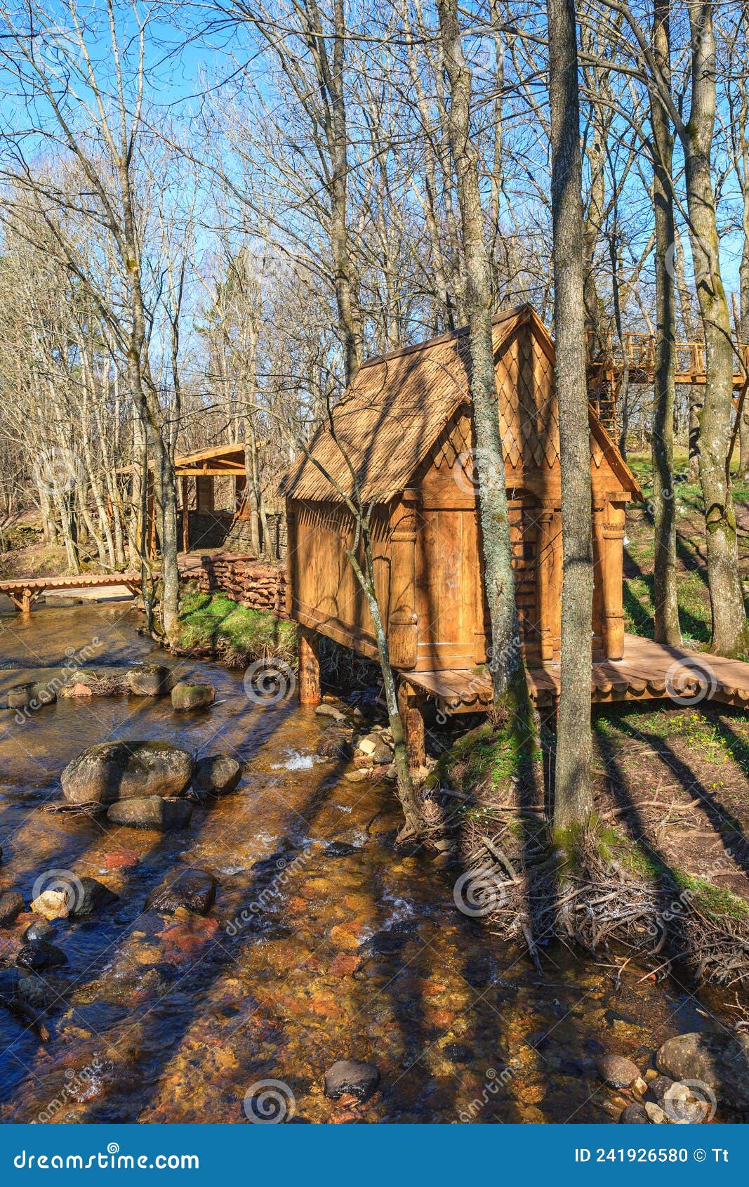 Log Cabins at a Stream in the Woodlands Stock Photo - Image of trees ...