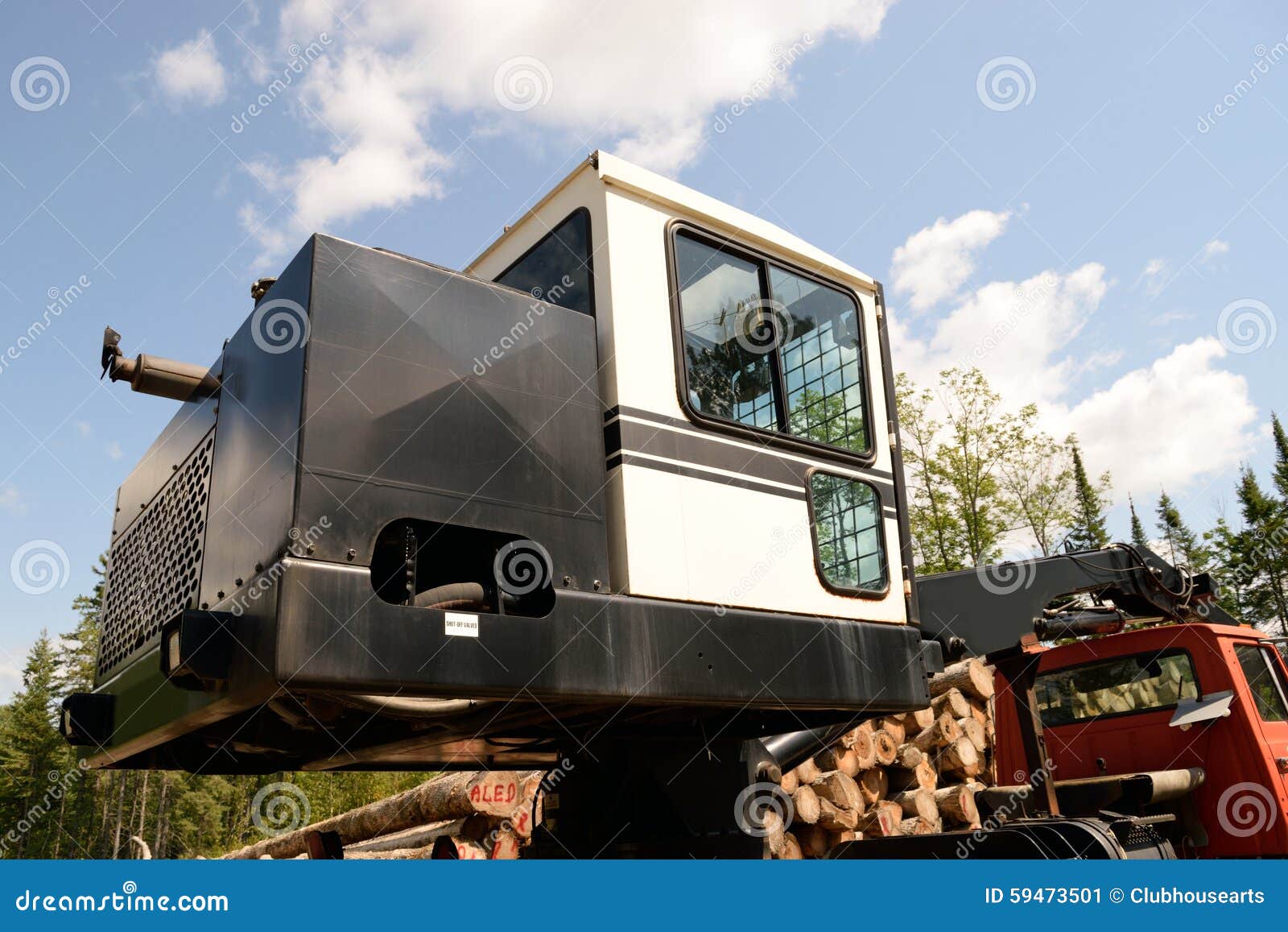 Log Truck and Loader with Wood Piled in Background Stock Image - Image ...