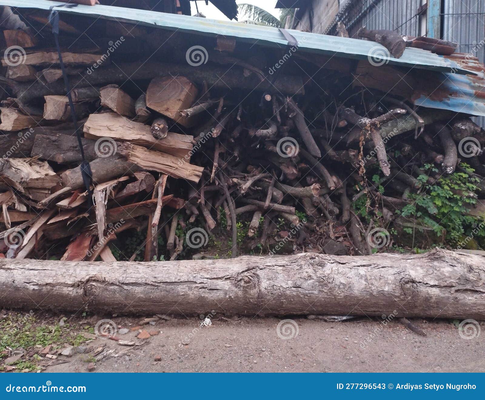A Log of Wood is Piled Up in Front of a Pile of Wood. Stock Image ...