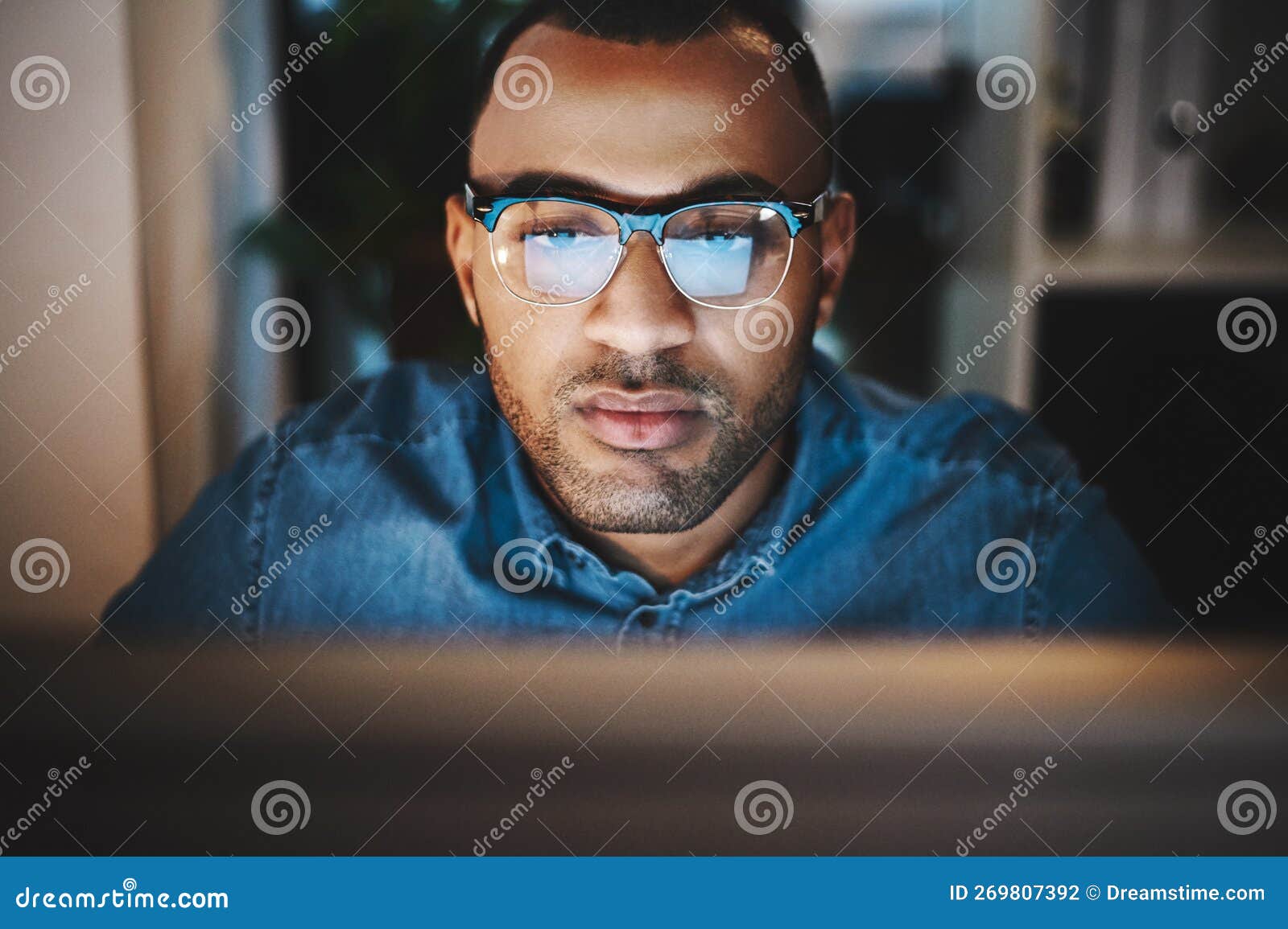 Logged into the Night Shift. a Young Businessman Using a Computer ...