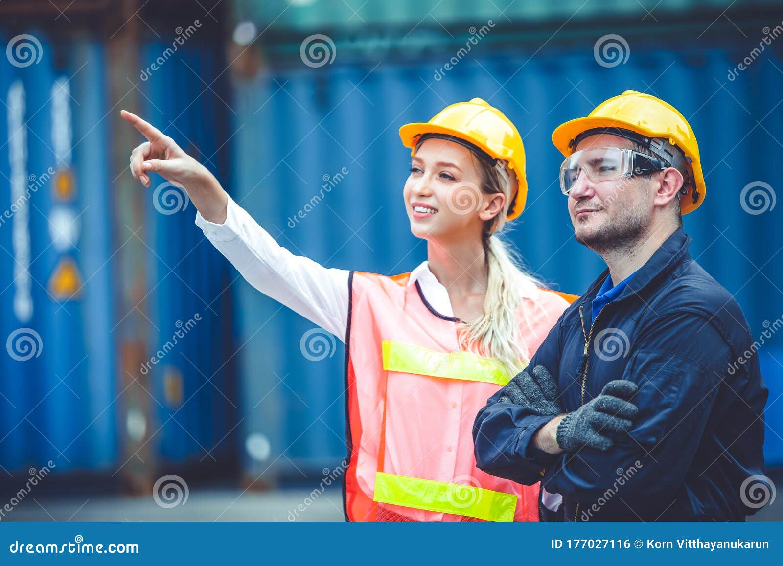 Logistic Worker Man And Woman Working Team With Radio Control Loading Containers At Port Cargo