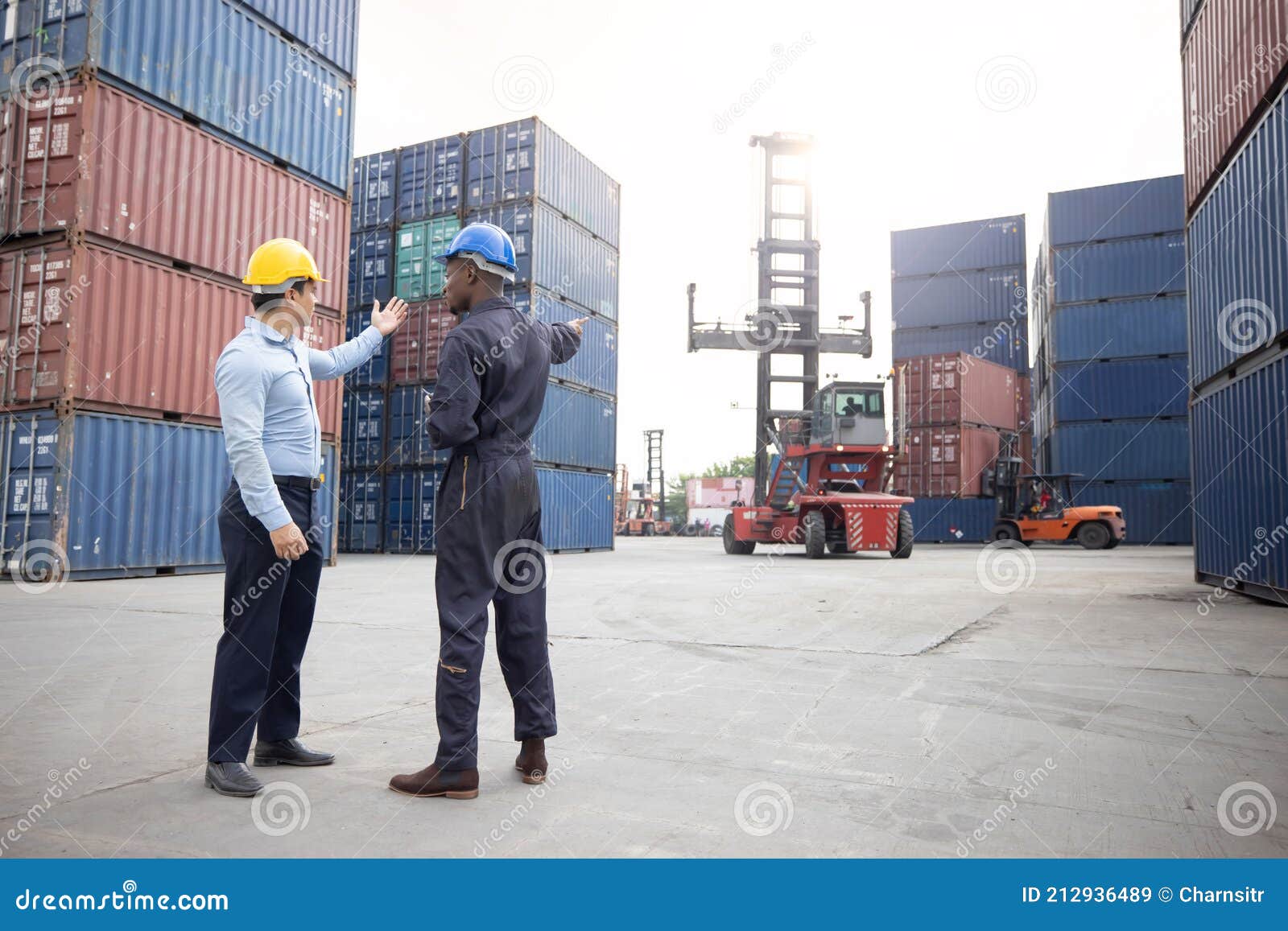 Logistic Workers Discussion and Pointing To the Cargo Containers Stock ...
