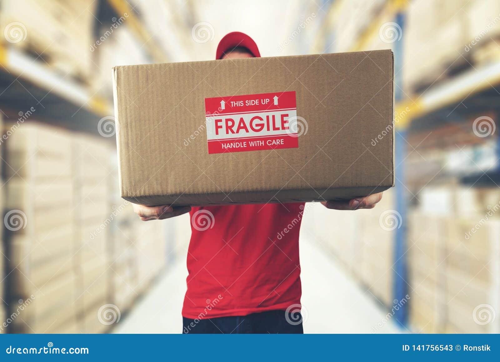 Logistics Warehouse Worker Holding Package with Fragile Items Stock ...
