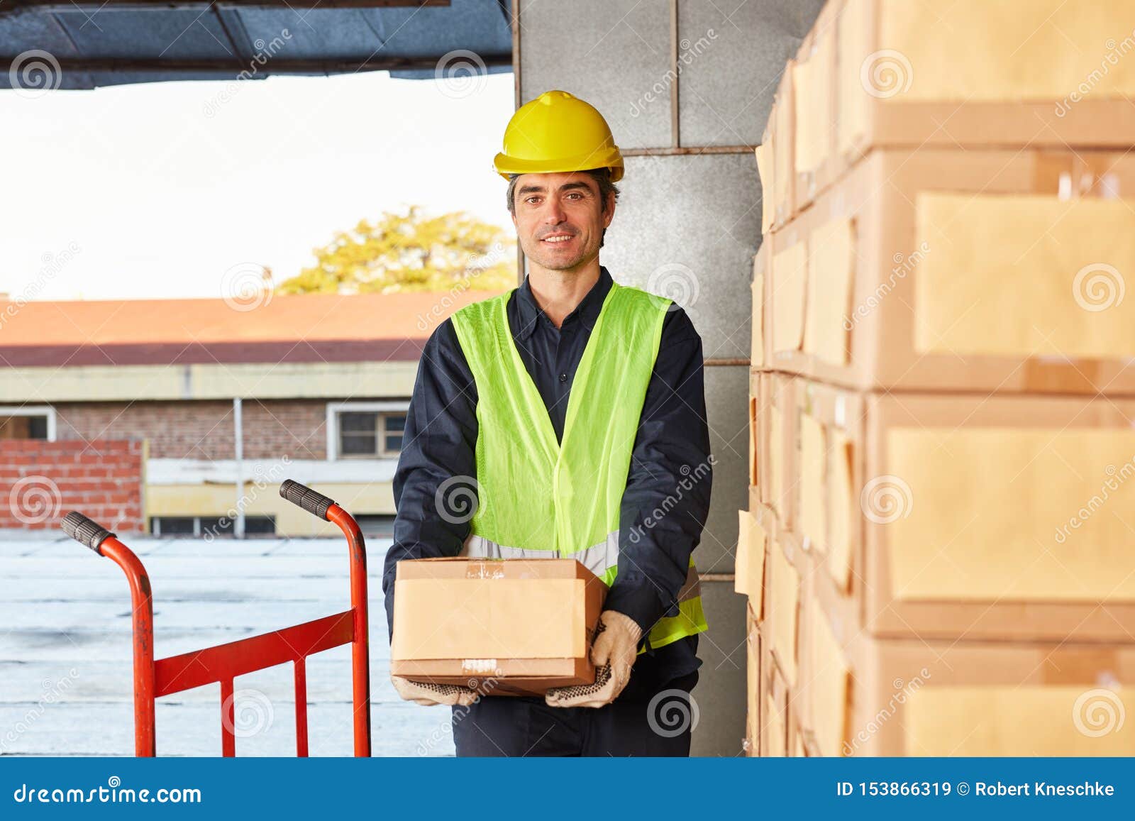 Logistics Worker with a Package for Shipping Stock Image - Image of ...