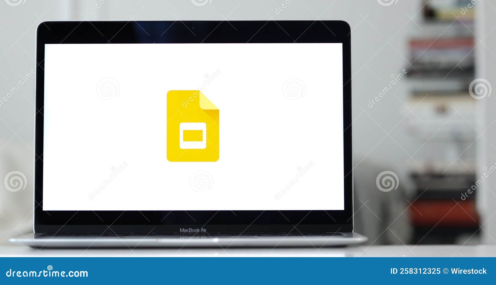 Logo Design of Google Slides on a Laptop Screen in Blurred Background ...