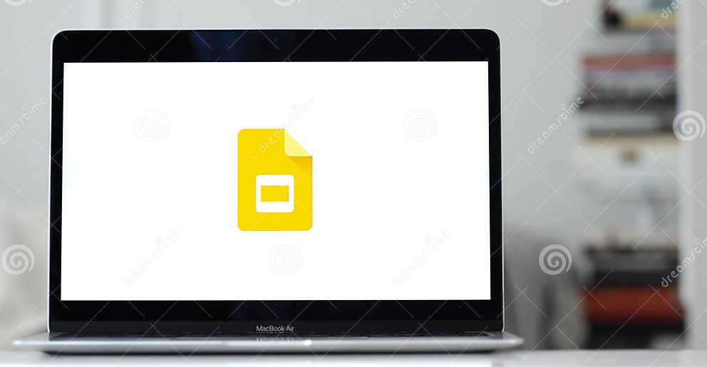 Logo Design of Google Slides on a Laptop Screen in Blurred Background ...