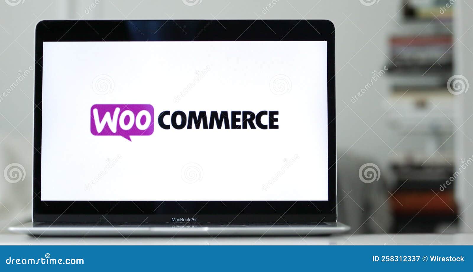 Logo Design of Woocommerce on a Laptop Screen in Blurred Background ...