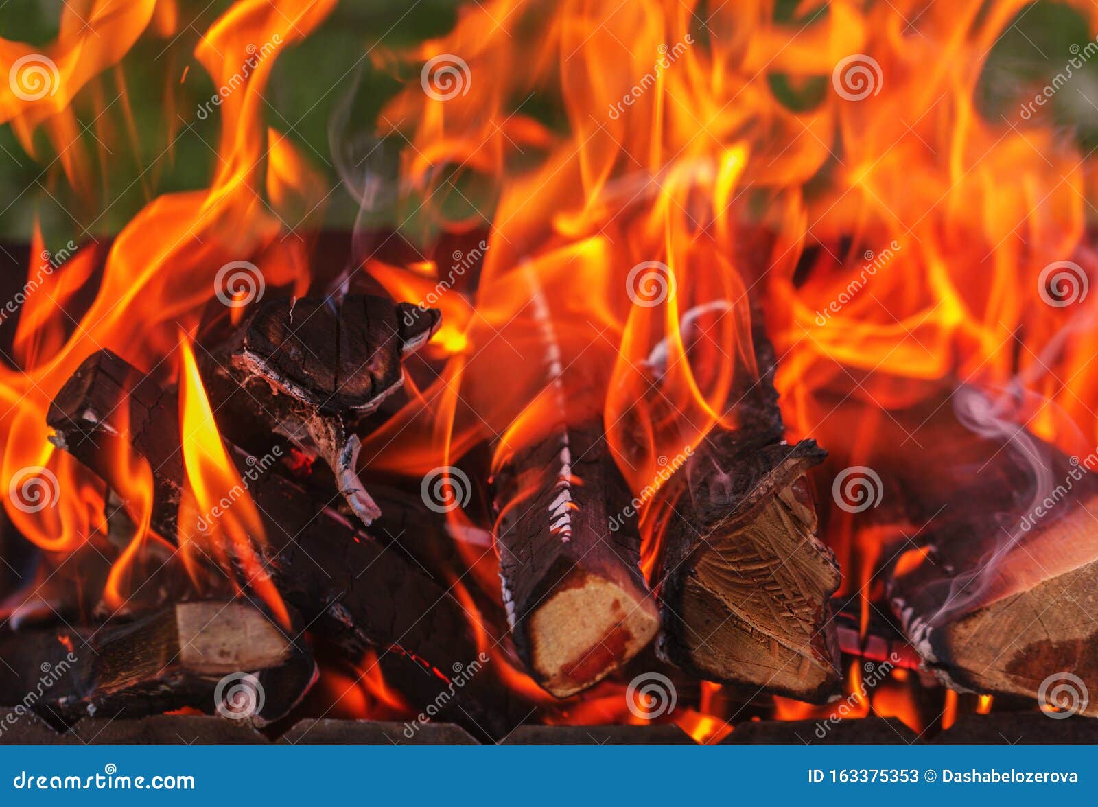 Logs in bright big fire stock image. Image of combustible - 163375353