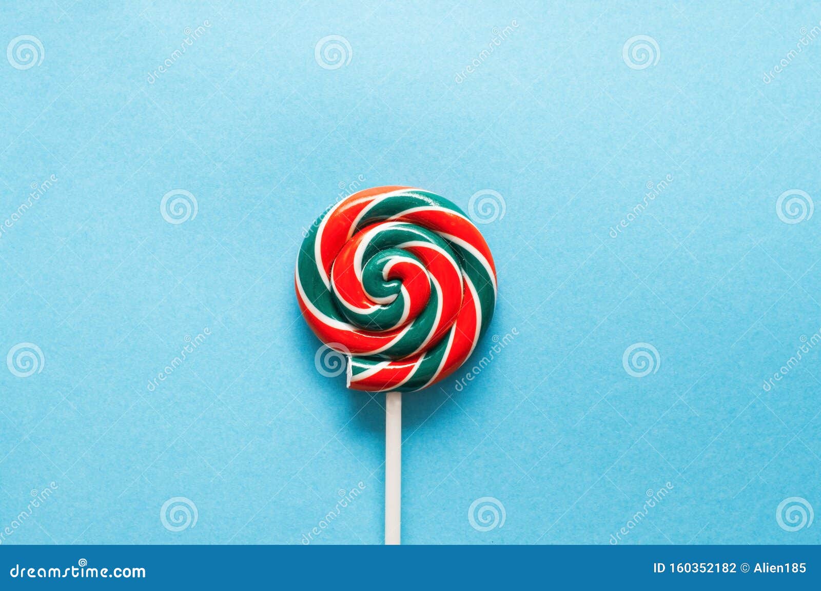 Lollipop on Blue Background Stock Photo - Image of colourful, candy ...
