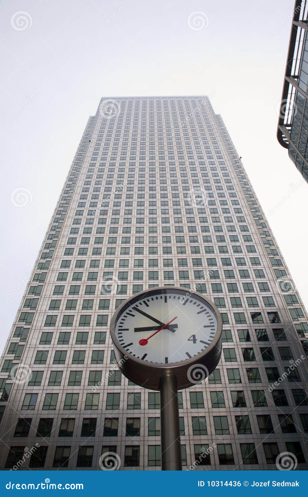 London - Clock and Canary Warf Skyscraper Stock Photo - Image of glass ...