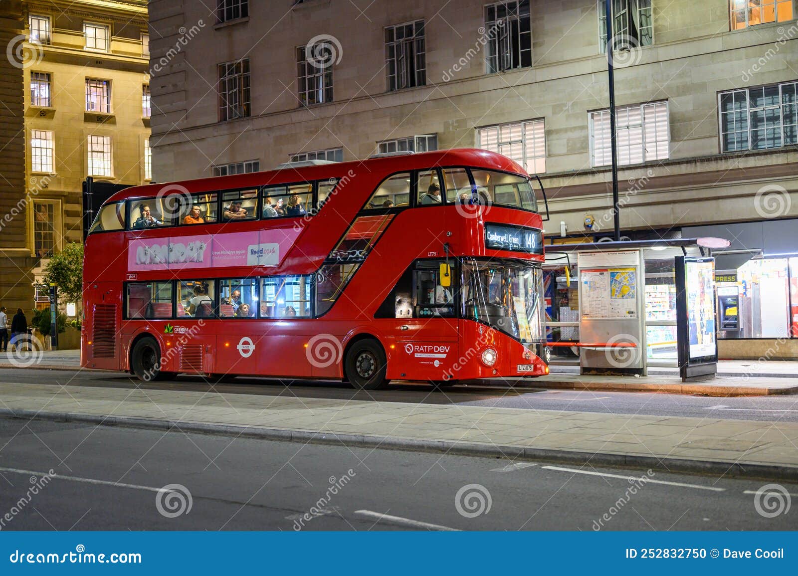London Double Decker Bus at a Bus Stop at Night Editorial Image - Image ...