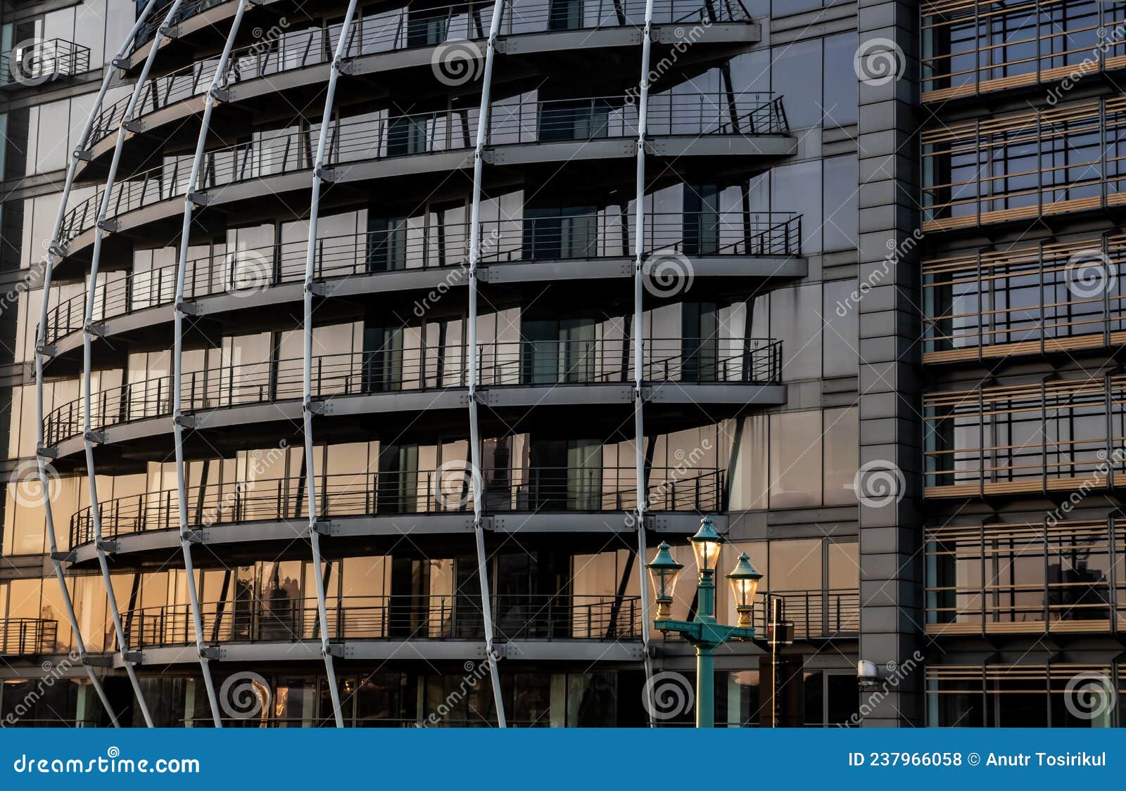 Modern Building with Repeating Structure and Reflected Sky and Clouds ...