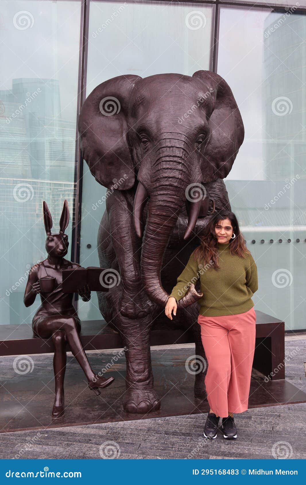 Indian Lady with Statue of an Elephant and Reading Rabbit Stock Image ...