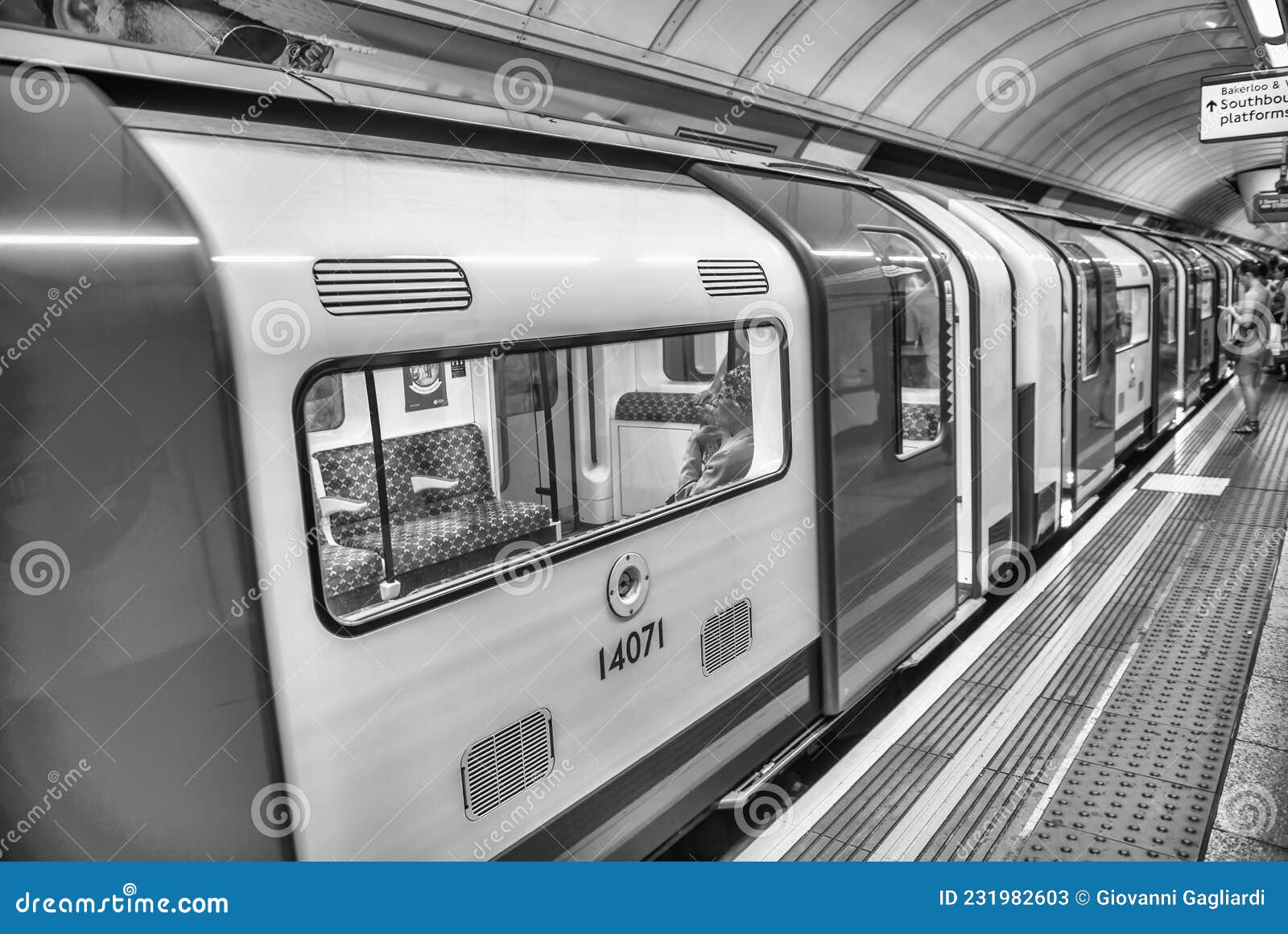 LONDON - JULY 1ST, 2015: Red Blue and White Underground Train at the ...