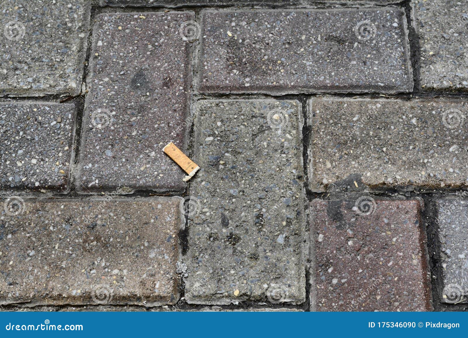 A Lone Cigarette Against a Brick Floor Stock Photo - Image of textured ...