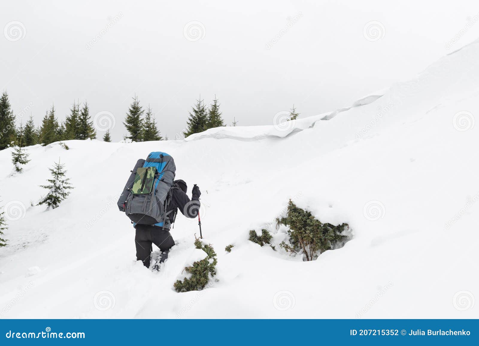 Lone hiker in deep snow stock photo. Image of storm - 207215352