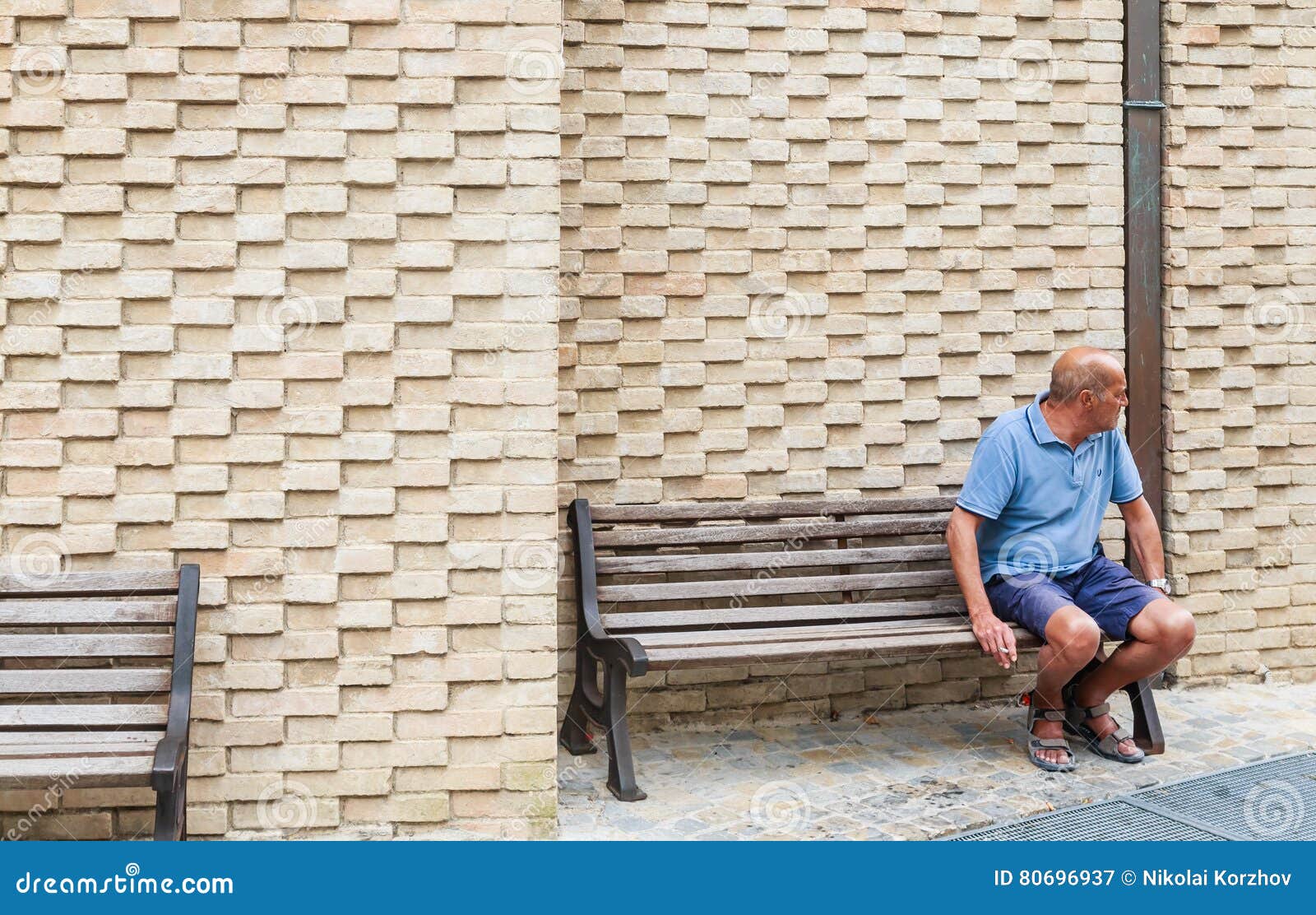 A Lone Man Sits on a Bench. Editorial Photography - Image of person ...