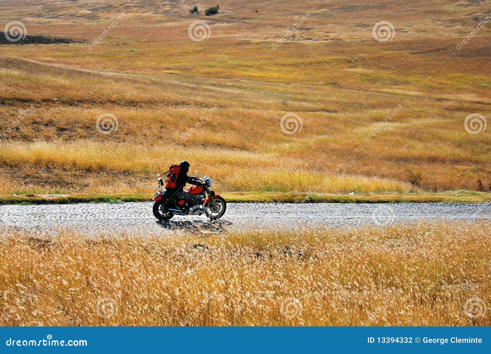Lone Motorcycle Rider stock photo. Image of transport - 13394332