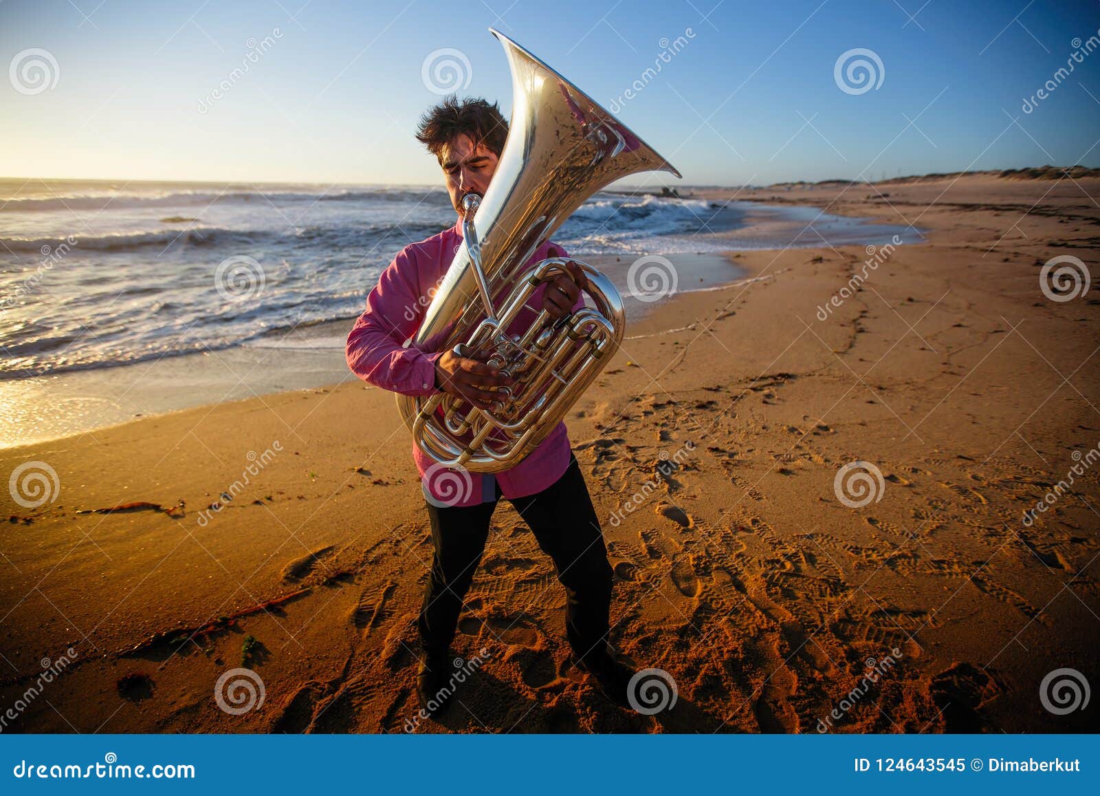Lone Musician Playing the Tuba on the Ocean Coast. Stock Image - Image ...