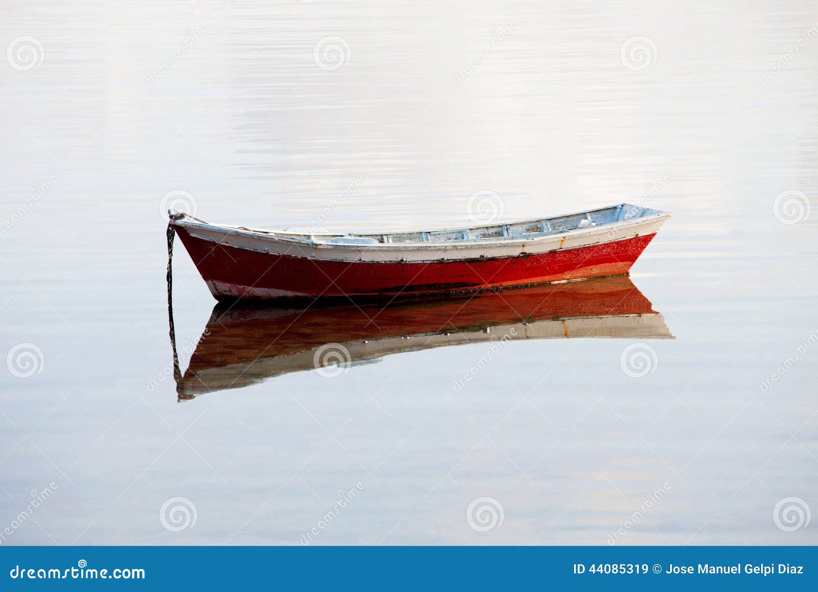 Lone red boat floating stock image. Image of ocean, color - 44085319