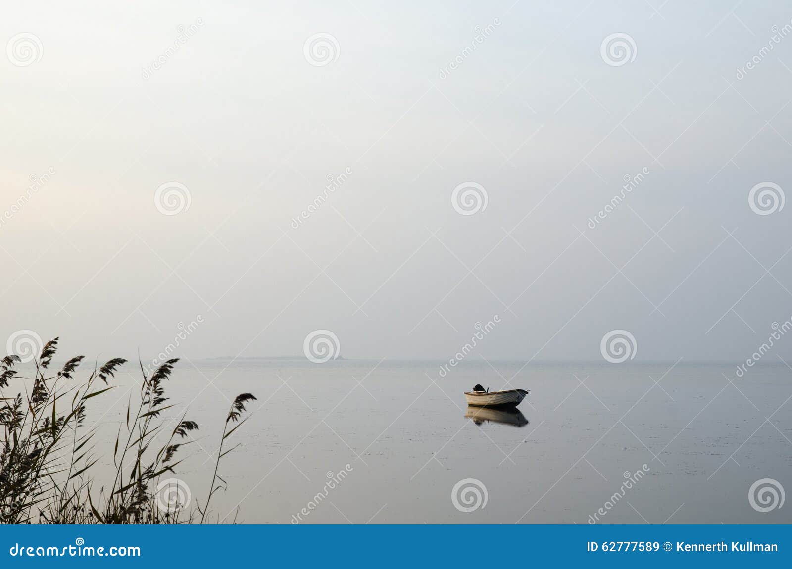 Lone Rowing Boat in Calm Water Stock Image - Image of empty, reeds ...