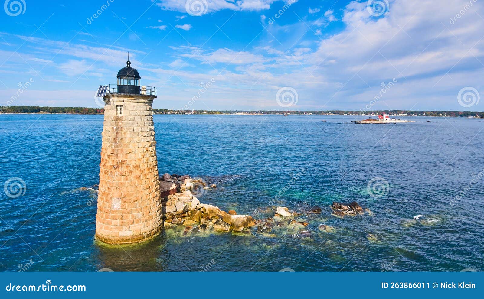 Lone Stone Tower Lighthouse on Broken Rocks in Maine Ocean Stock Image ...