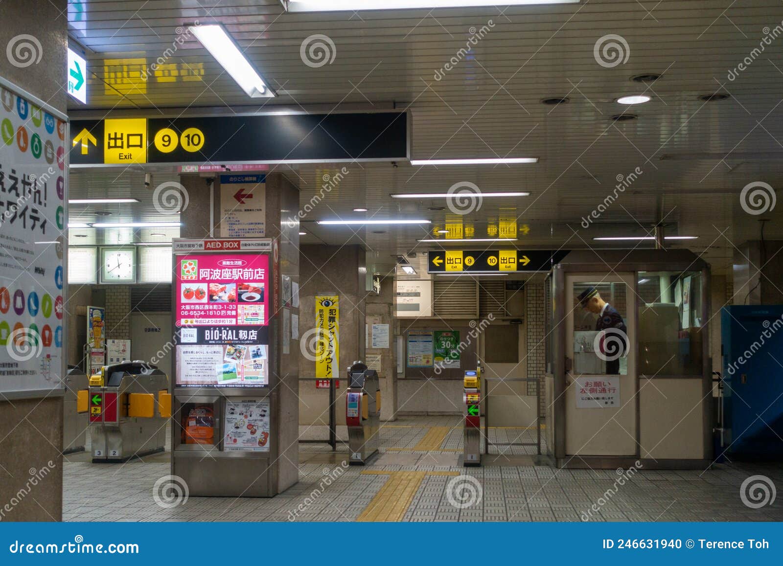 A Lone Train Station Master Standing Inside a Booth in an Osaka Metro ...