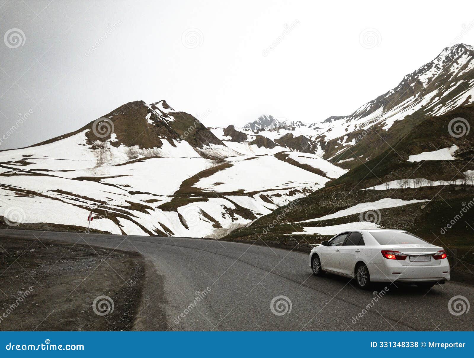 Lone White Car in Mountain Road Stock Photo - Image of snowed, rising ...
