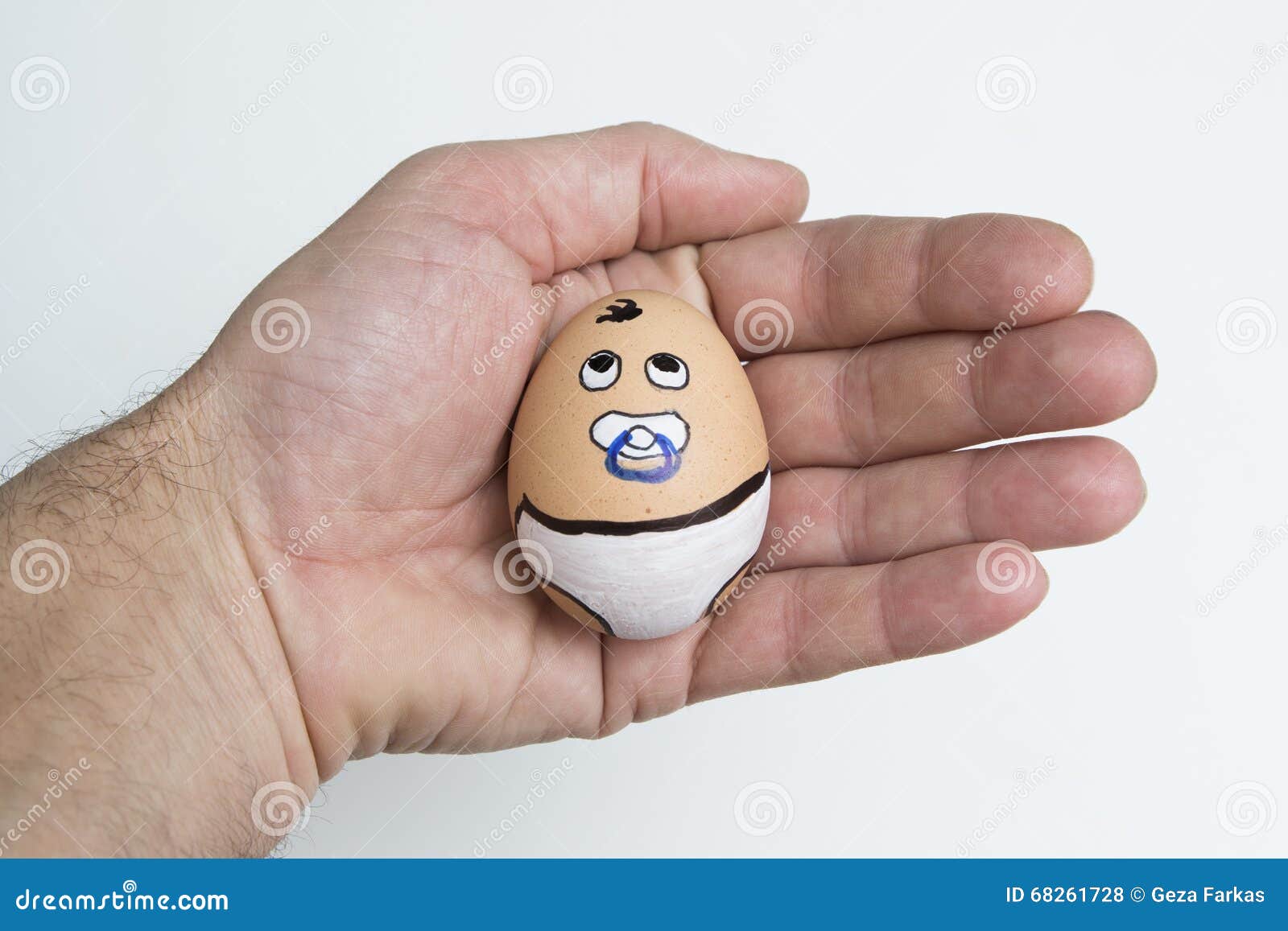 Lonely Baby Egg Face in Man Hand Stock Photo - Image of fresh, object ...