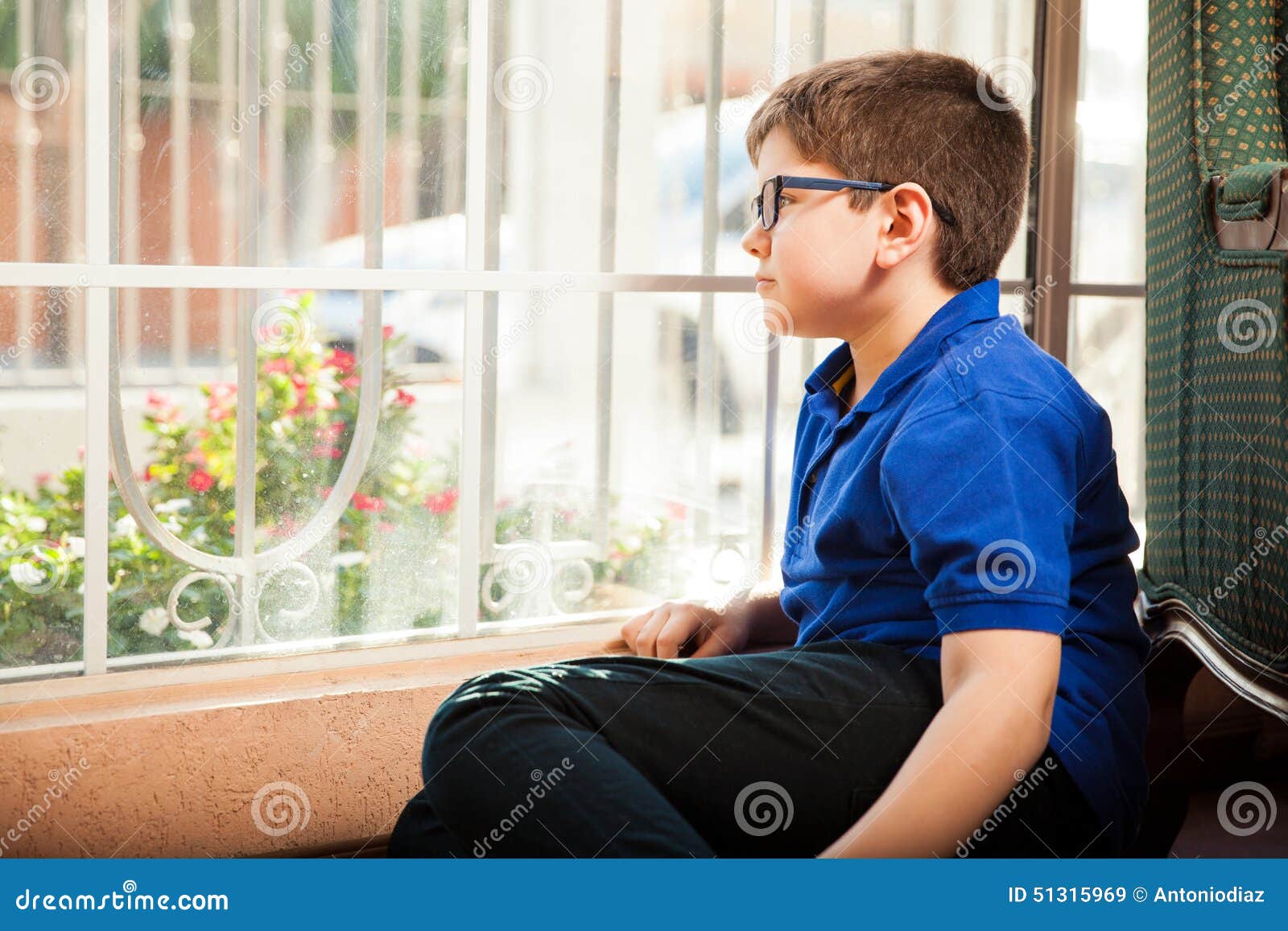 Lonely boy looking outside stock image. Image of childhood - 51315969