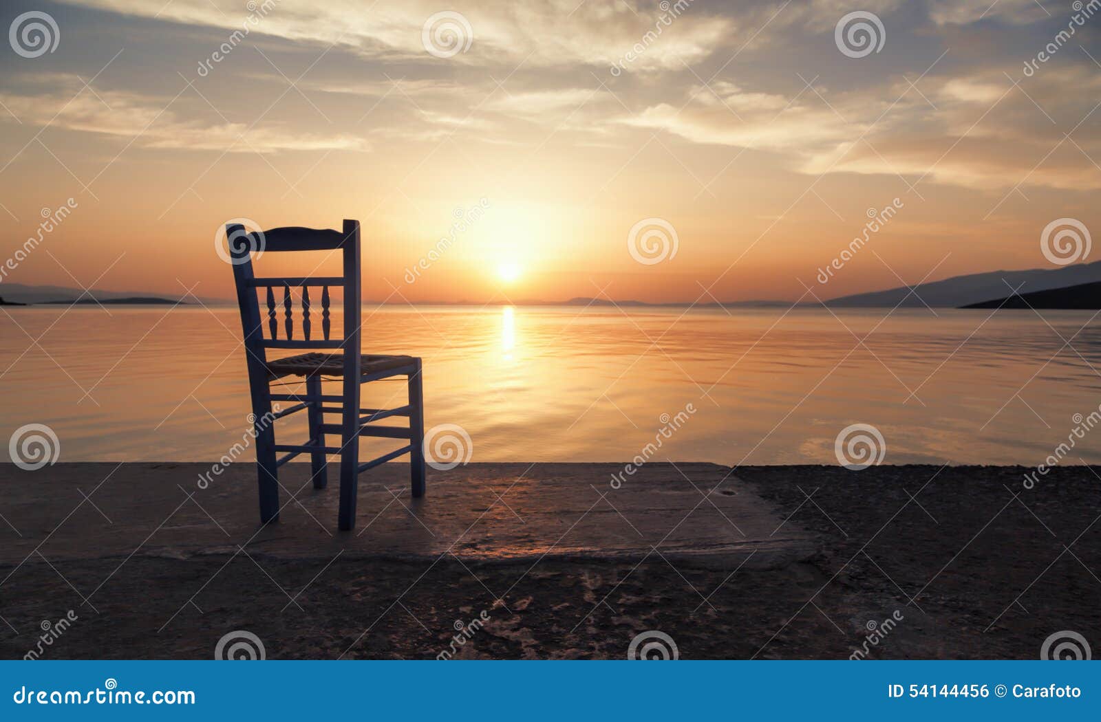 A Lonely Chair on the Sea at Sunset Stock Photo - Image of ...