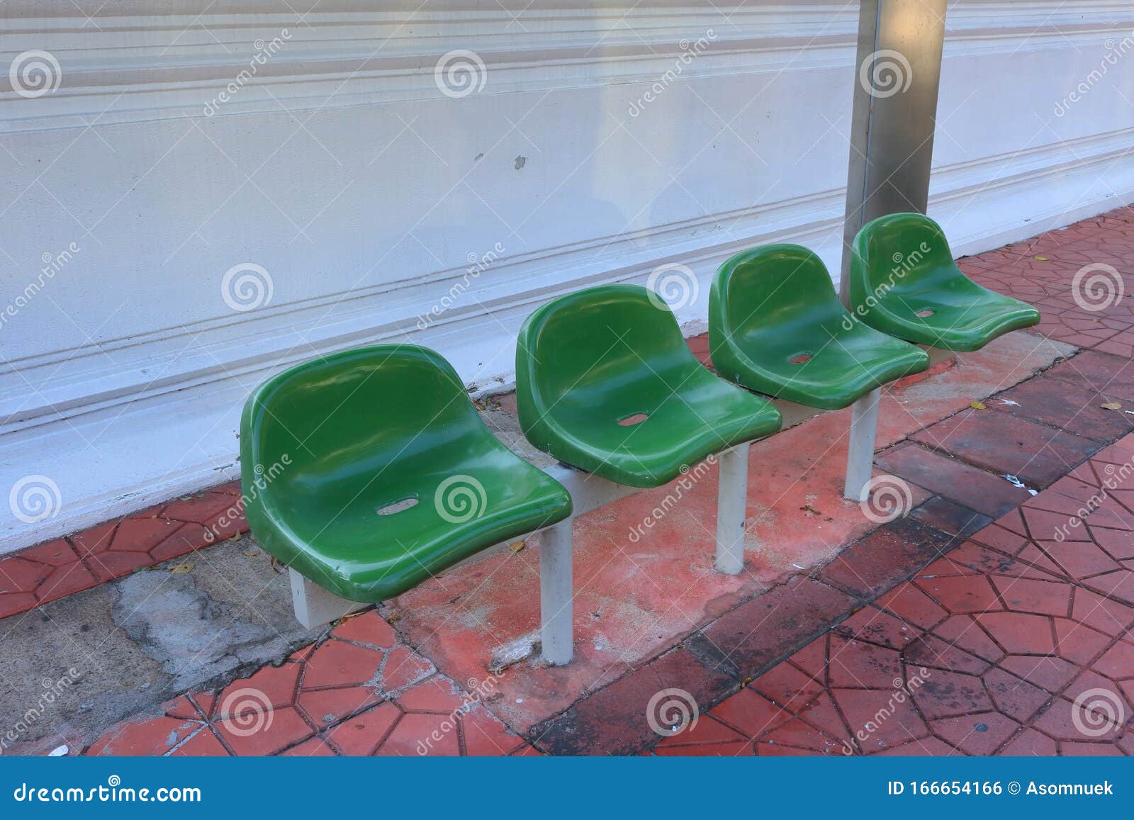 Lonely chairs at bus stop stock photo. Image of green - 166654166