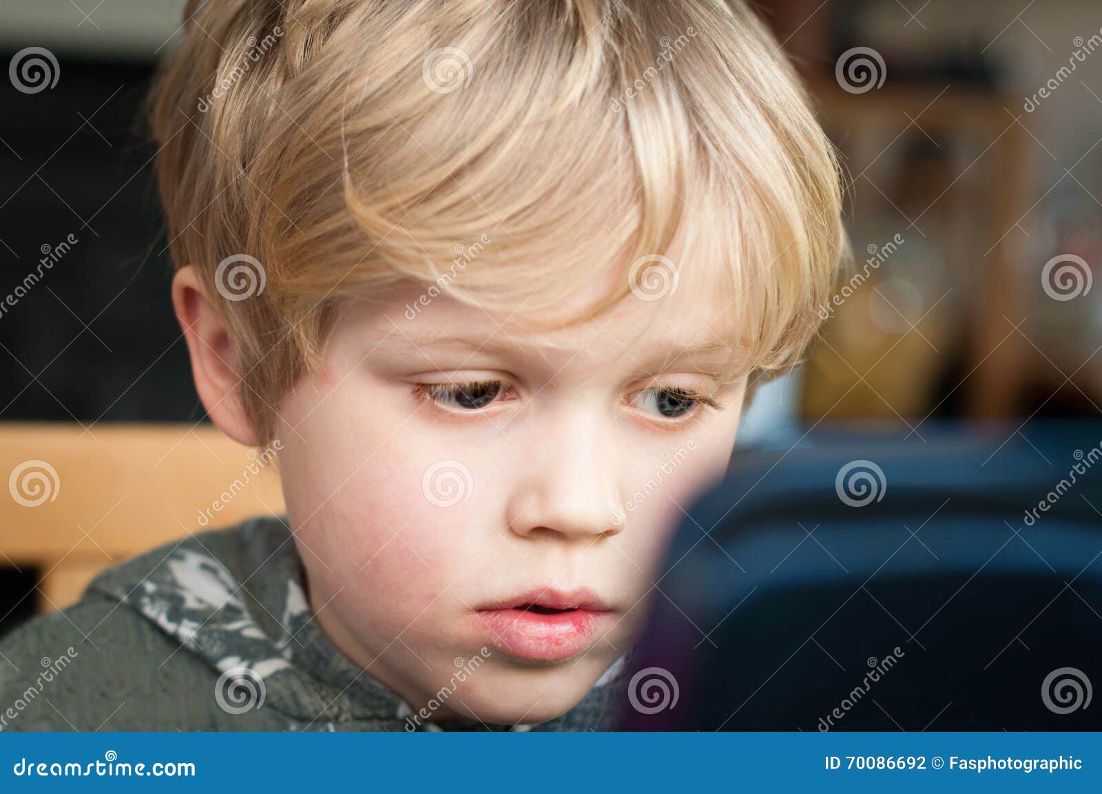 Lonely child using laptop stock photo. Image of website - 70086692