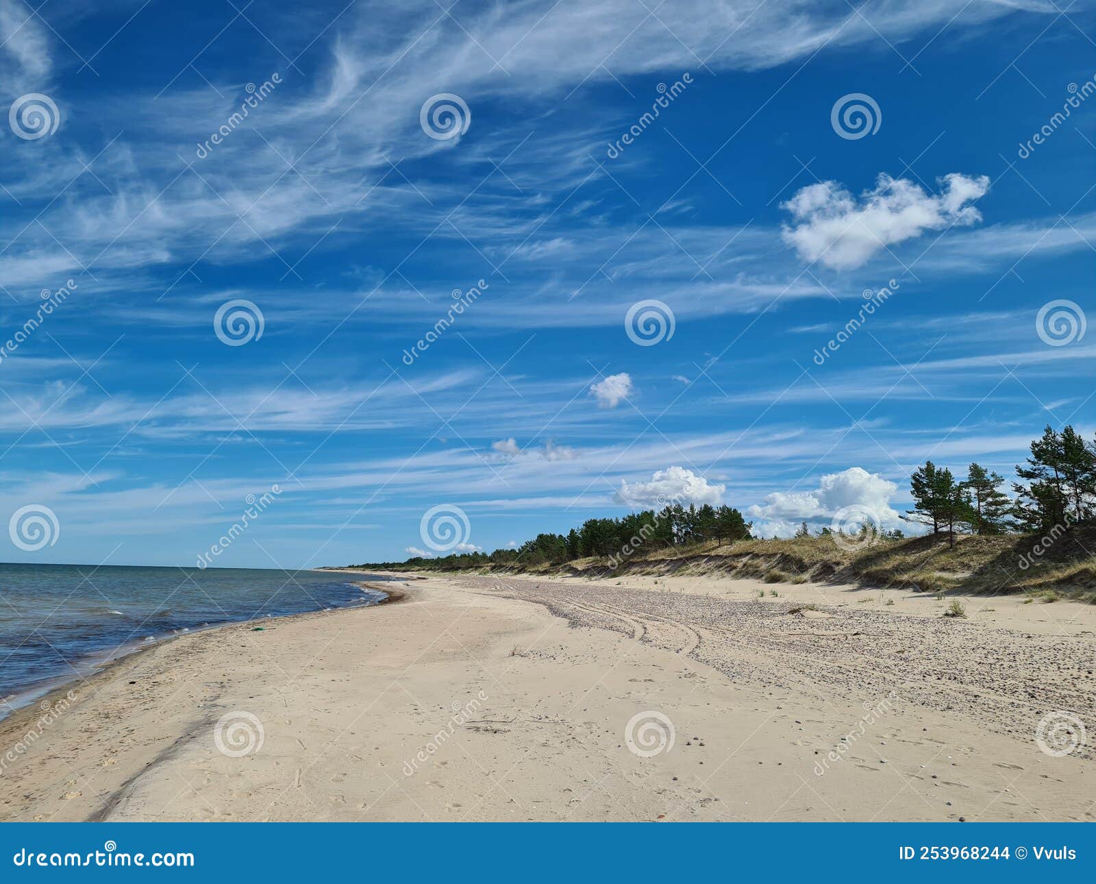 Lonely Coastline and Blue Sky with Light Clouds Stock Photo - Image of ...