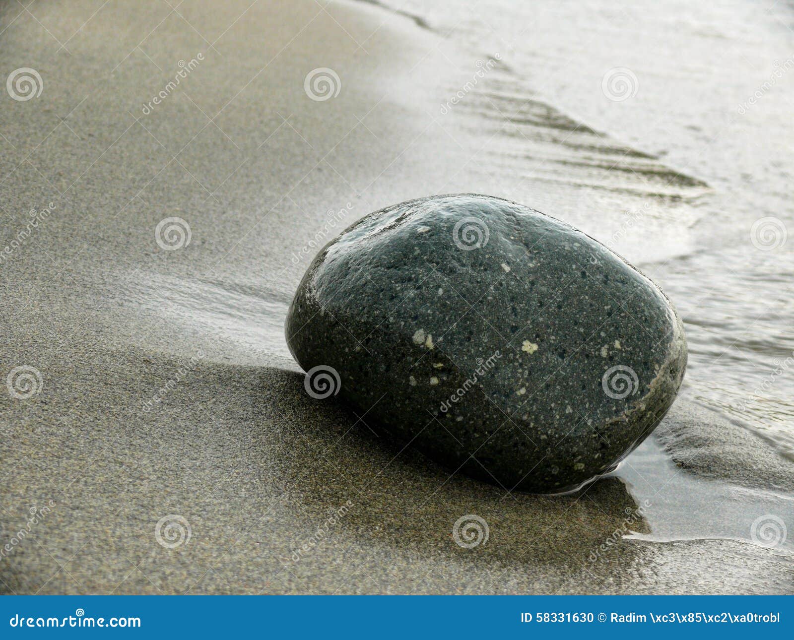Lonely pebble in sand stock photo. Image of wave, nature - 58331630