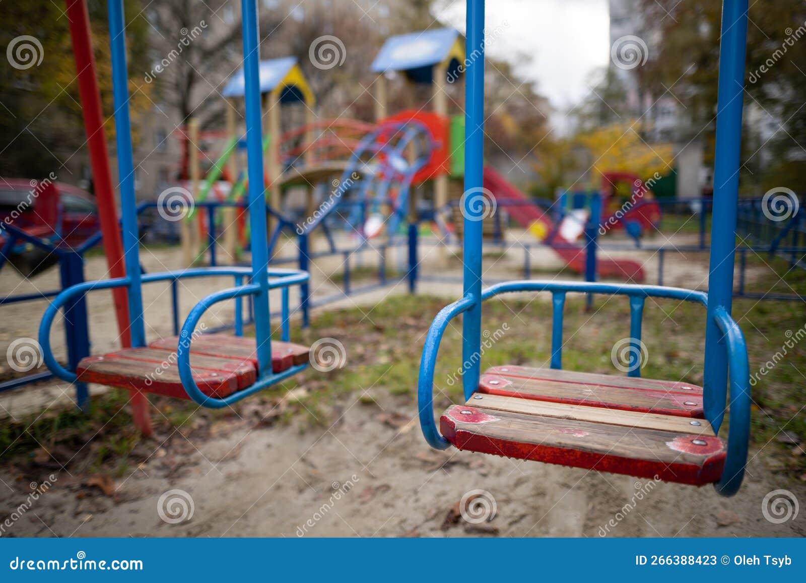 A Lonely Empty Swing on a Playground without People Stock Image - Image ...
