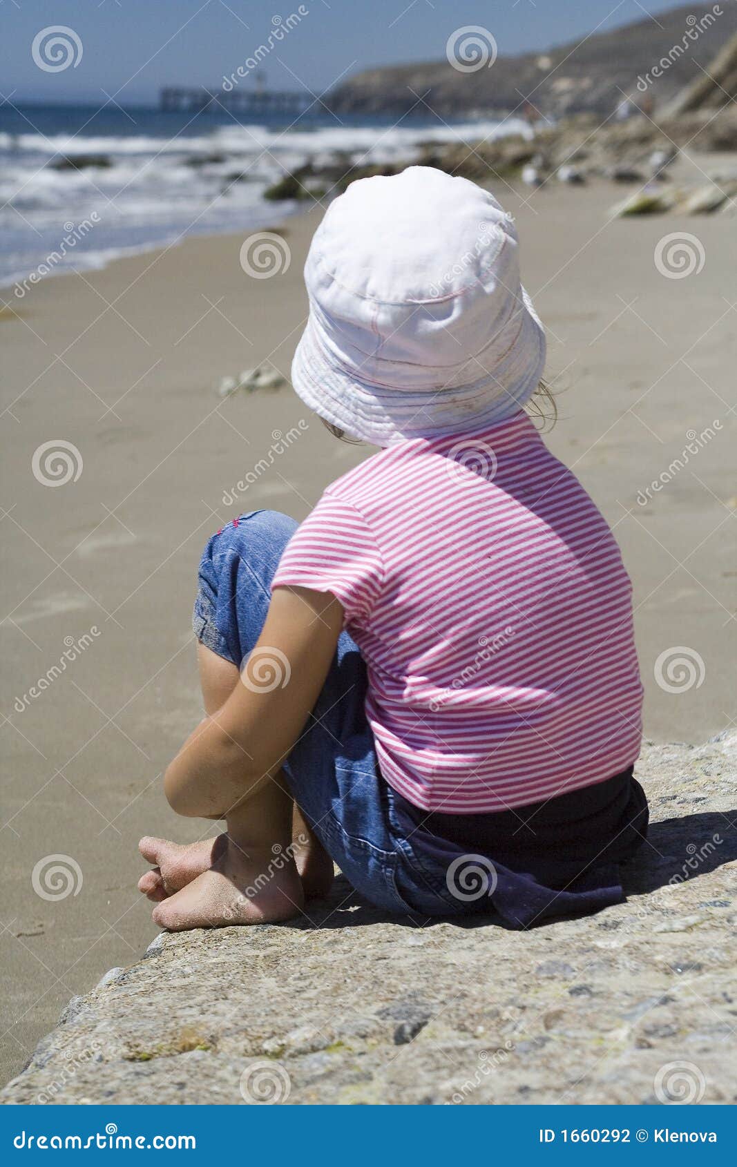 Lonely girl on the beach stock photo. Image of holiday - 1660292