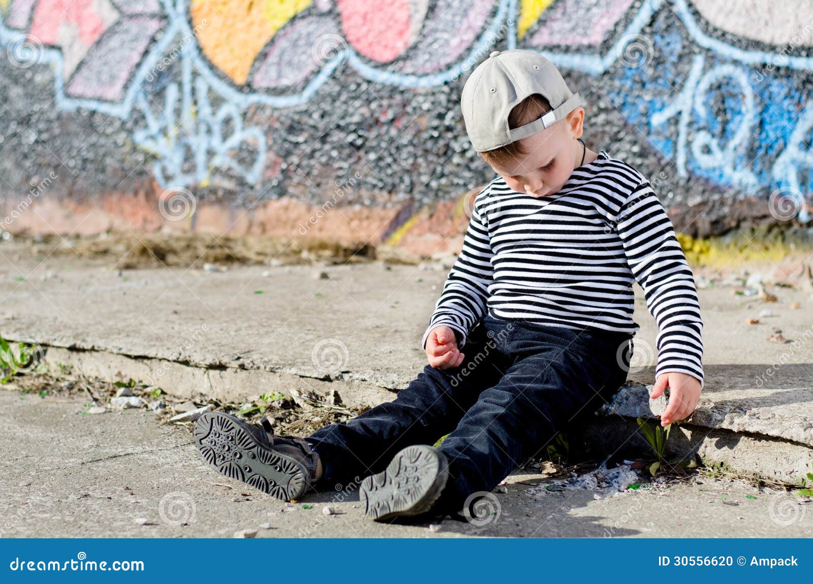 Lonely Little Boy Sitting on Stock Photo - Image of handsome, pavement ...