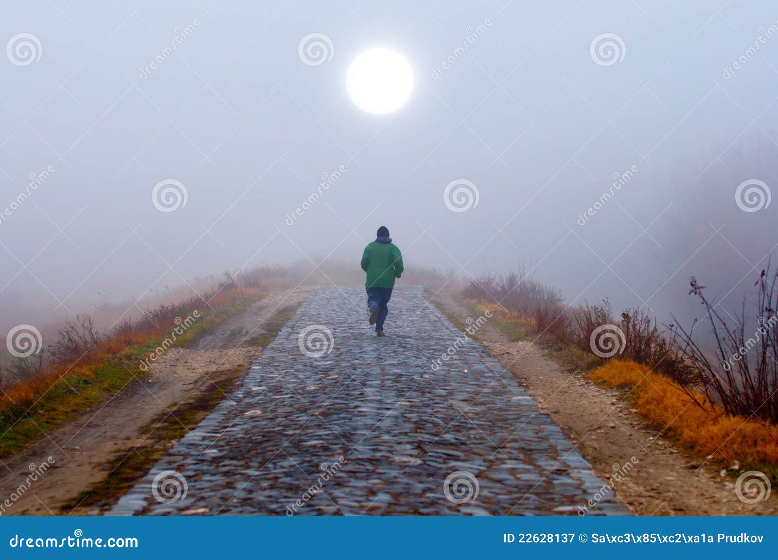 Lonely Man Running Toward the Sun on Misty Morning Stock Image - Image ...