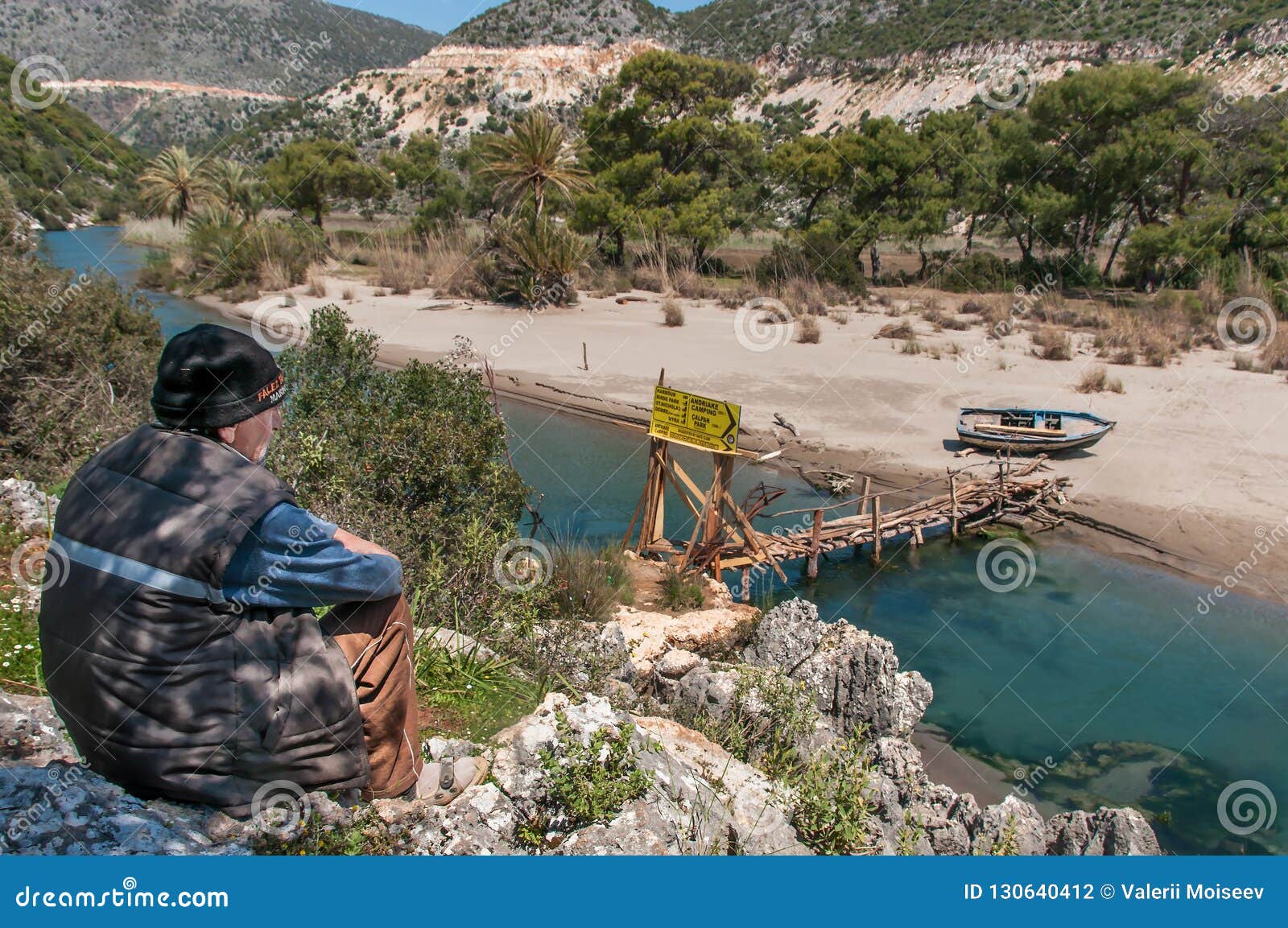Lonely Man Sits Looking at the Wooden Bridge in the Mountains Editorial ...