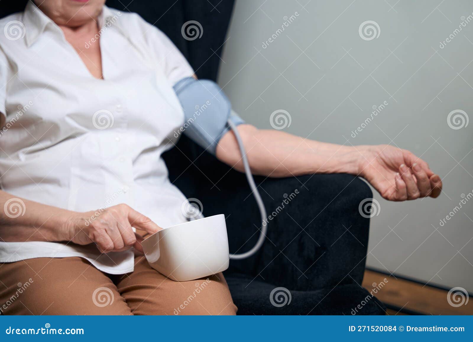 Lonely Old Woman Sits in Chair and Measures Her Blood Pressure Stock ... Lonely Old Woman Sits in Chair and Measures Her Blood Pressure Stock ...