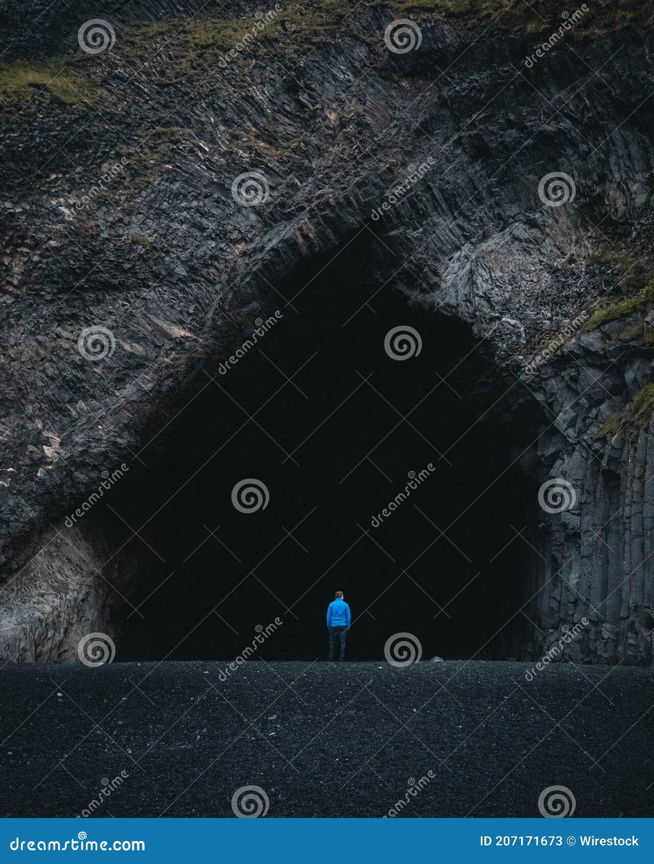 Lonely Person Standing in Front of a Huge Cave Stock Image - Image of ...