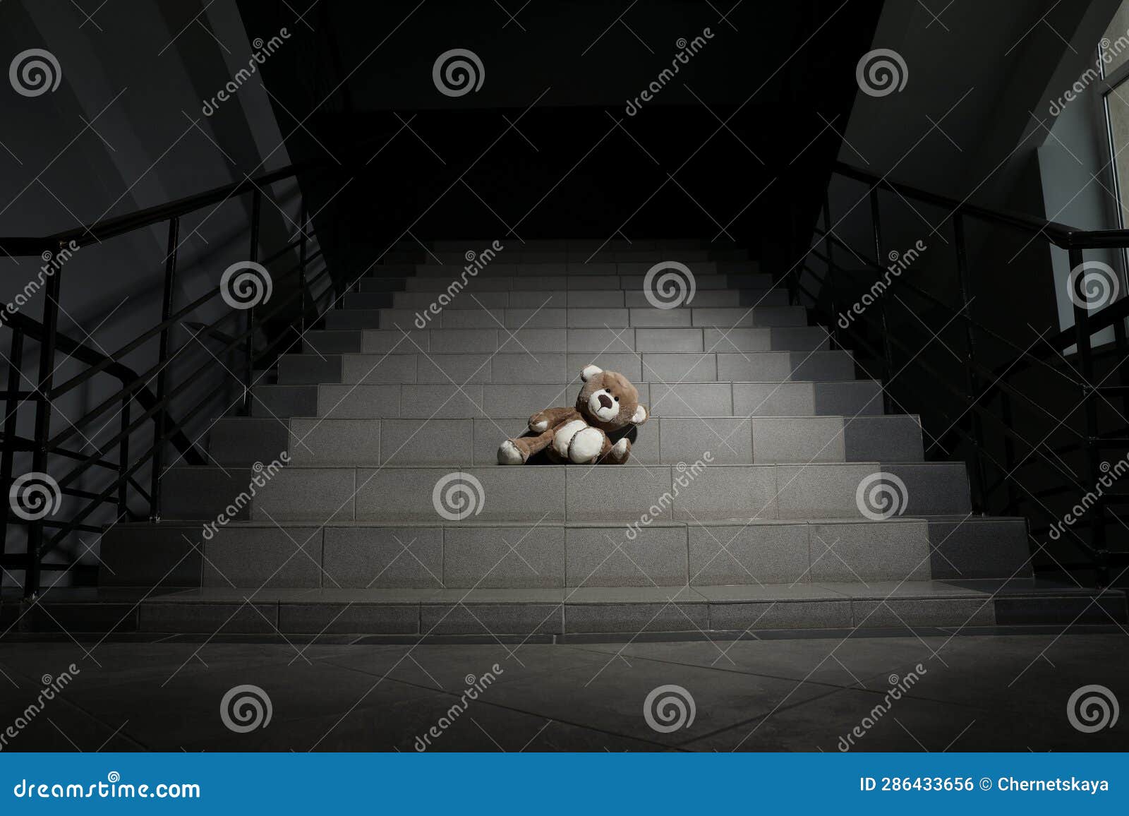 Lonely Teddy Bear on Grey Stairs Indoors Stock Photo - Image of ...