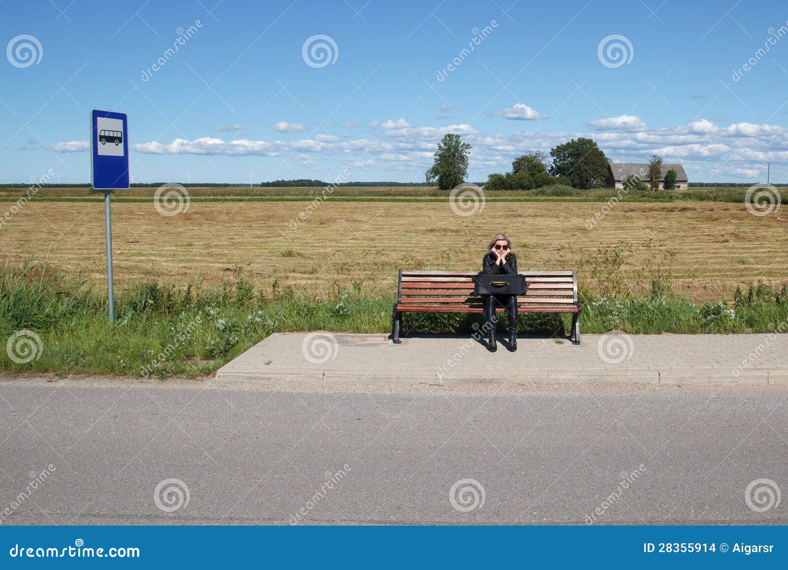Lonely woman in bus stop stock photo. Image of person - 28355914