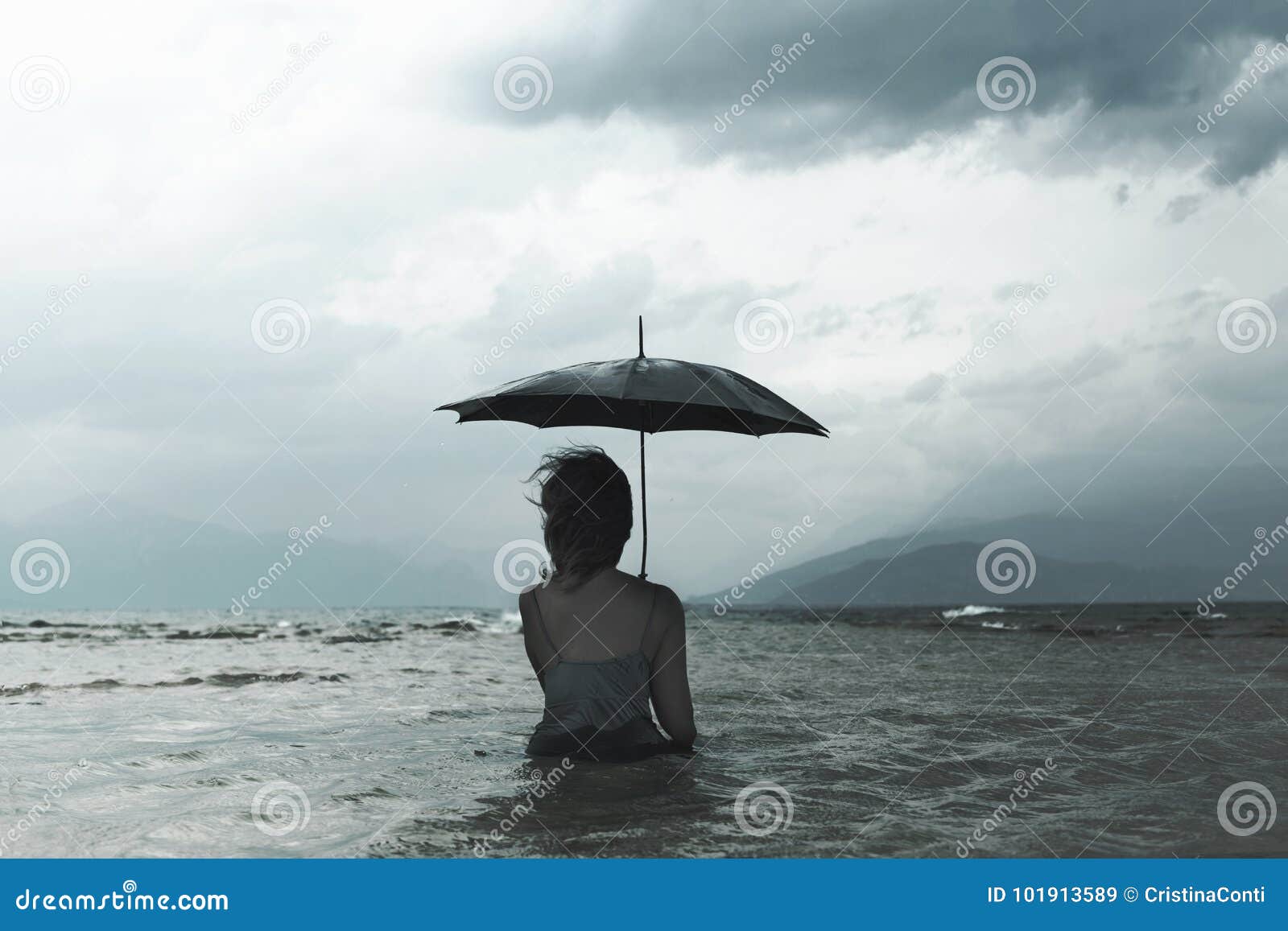 Lonely Woman Meditating Looking at Infinity in the Rain and ...