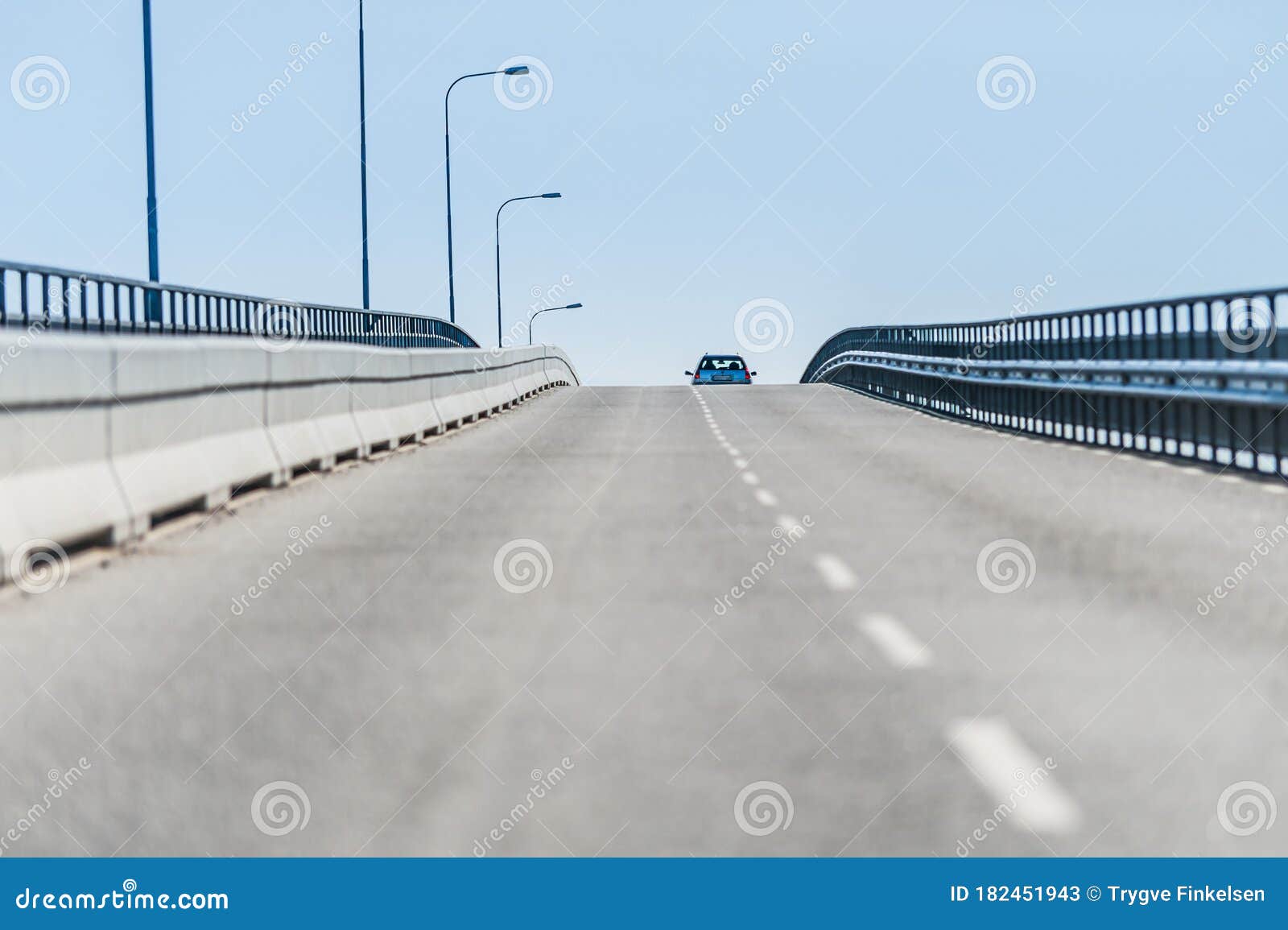 A Lonesome Car Driving Over a Bridge Stock Image - Image of freeway ...