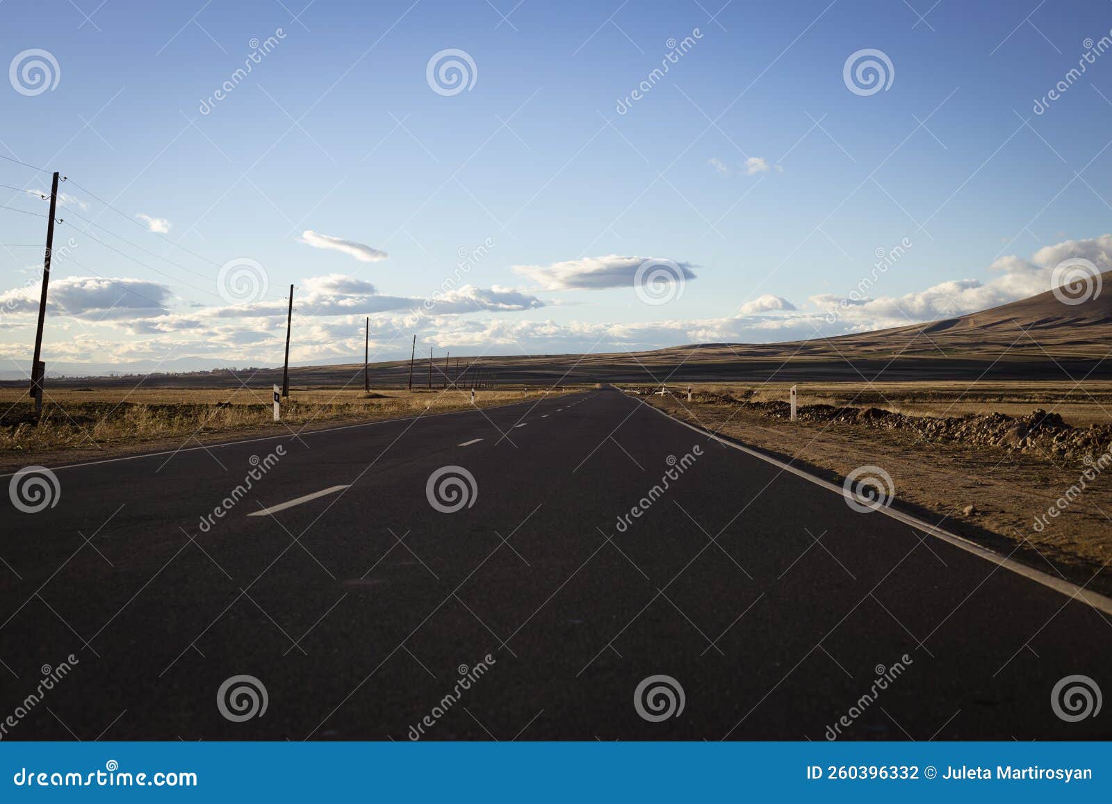 Long Asphalt Road and Fields Stock Photo - Image of highway, traffic ...