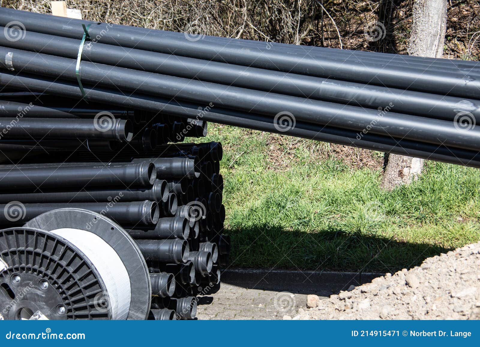 Long black plastic pipes stock image. Image of construction - 214915471