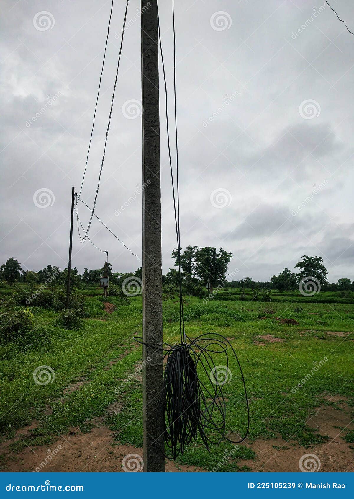 The Long Black Wire is Bound and Hanging on the Pole. Stock Image ...