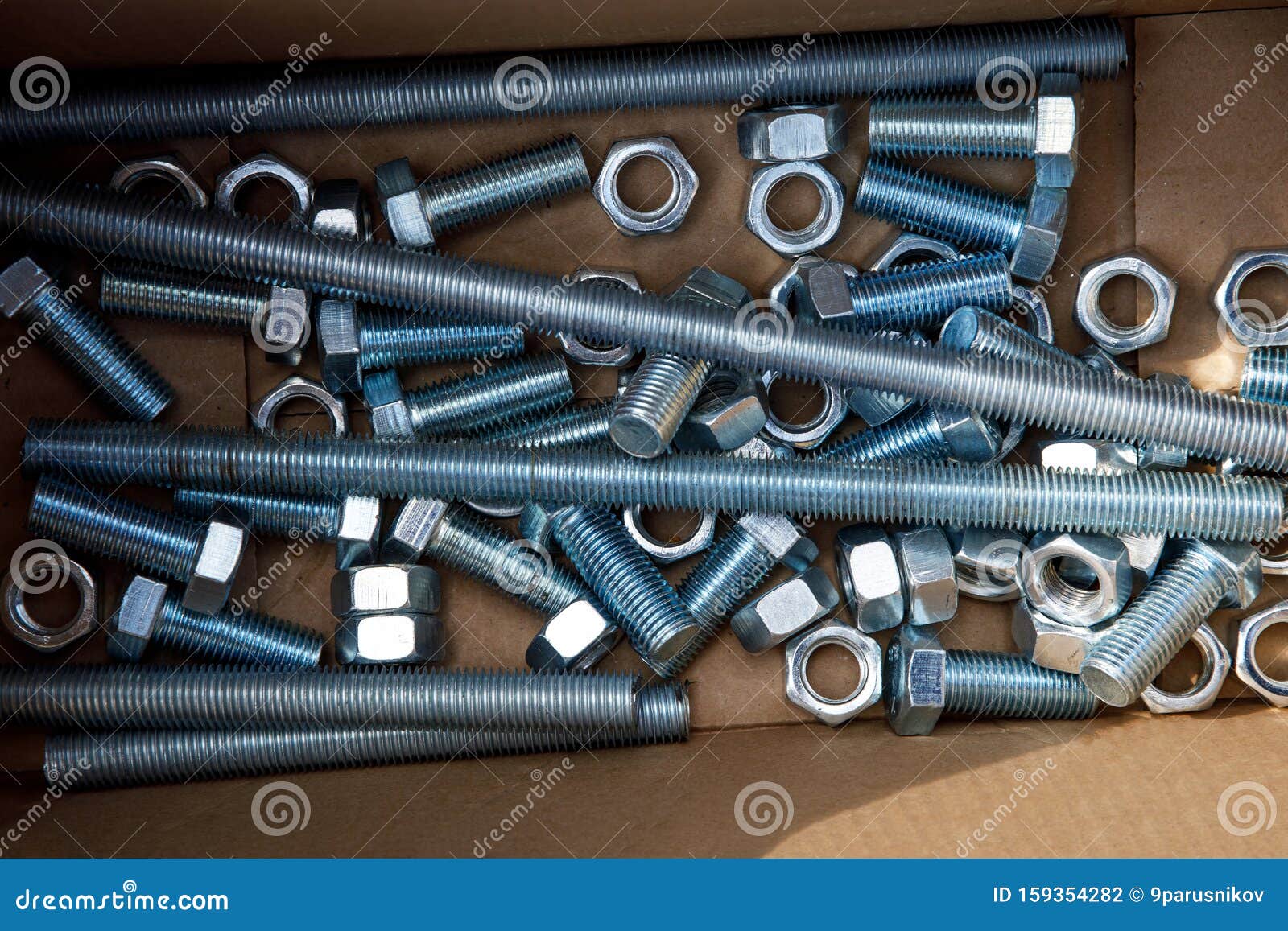 Long Bolts and Nuts in a Box Stock Photo - Image of hardware, metal ...